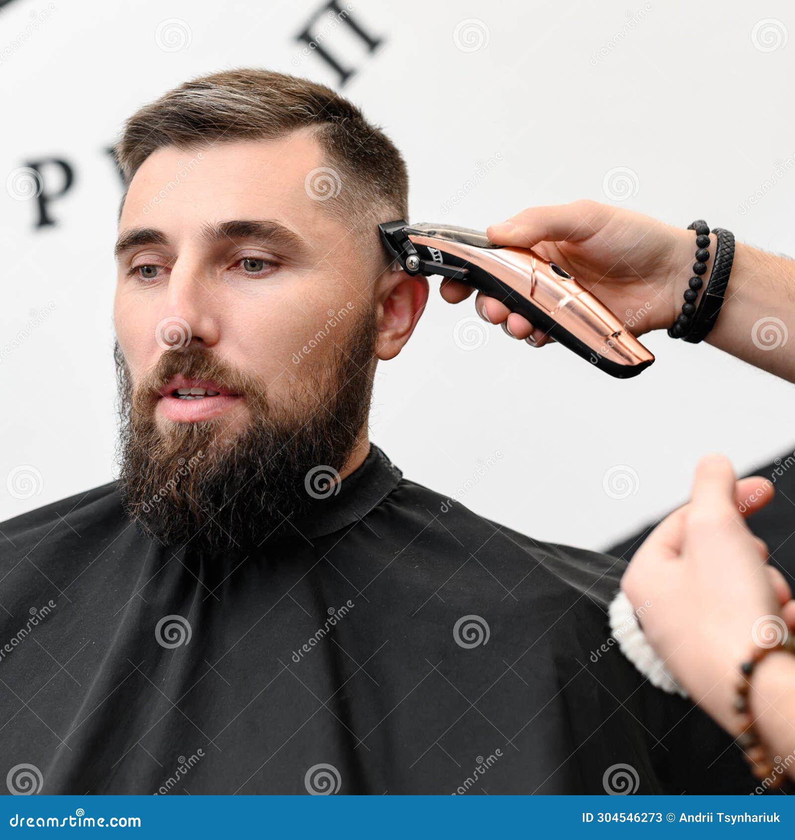 A Barber Cuts a Man with a Beard in a Barber Shop. Short Haircut of the ...