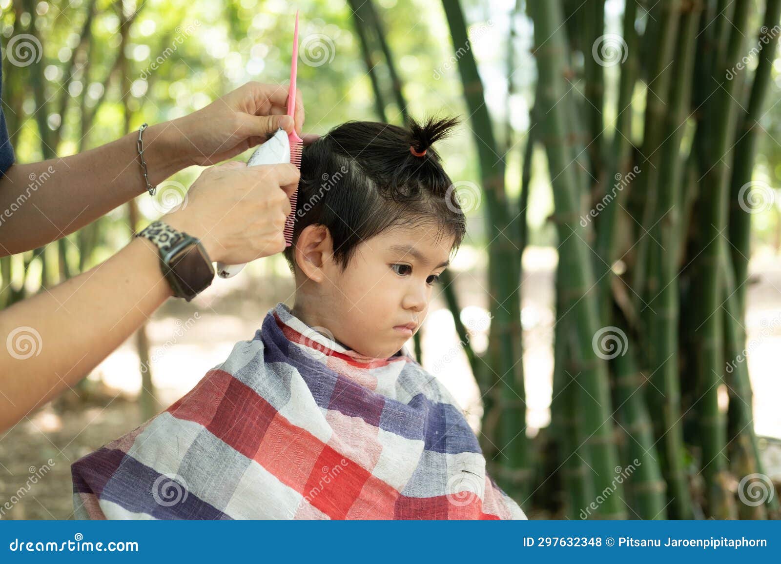 Barber Cutting Hair of an Asian Boy in an Open Space Filled with Trees ...