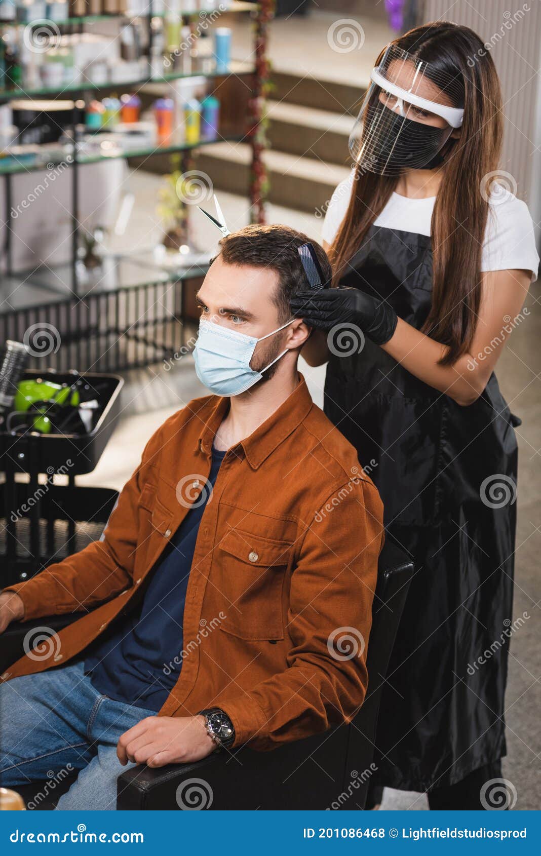 Barber in Protective Equipment Holding Scissors Stock Photo - Image of ...