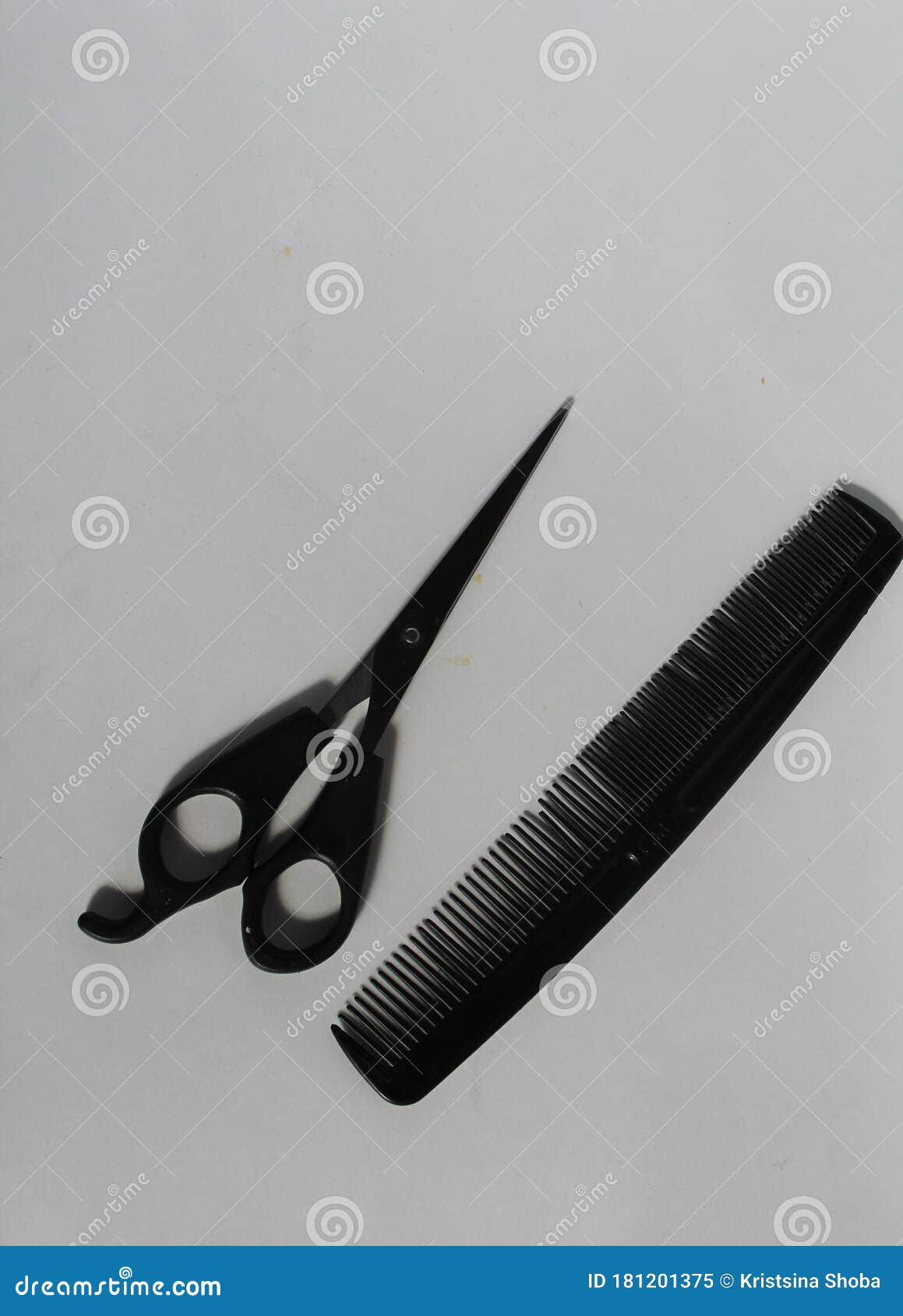 Barber`s Scissors and Comb Lie Side by Side on a White Background Stock ...