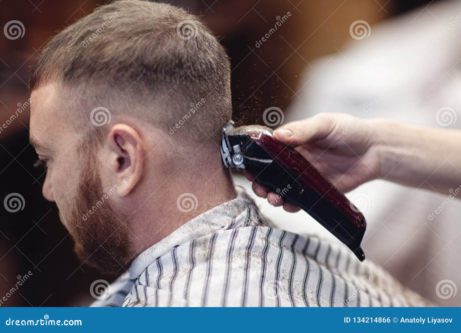 Barber Shaves the Client`s Head with a Shaving Machine Stock Photo ...