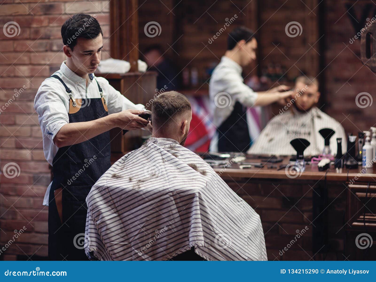 Barber Shaves the Client`s Head with a Shaving Machine Stock Photo ...