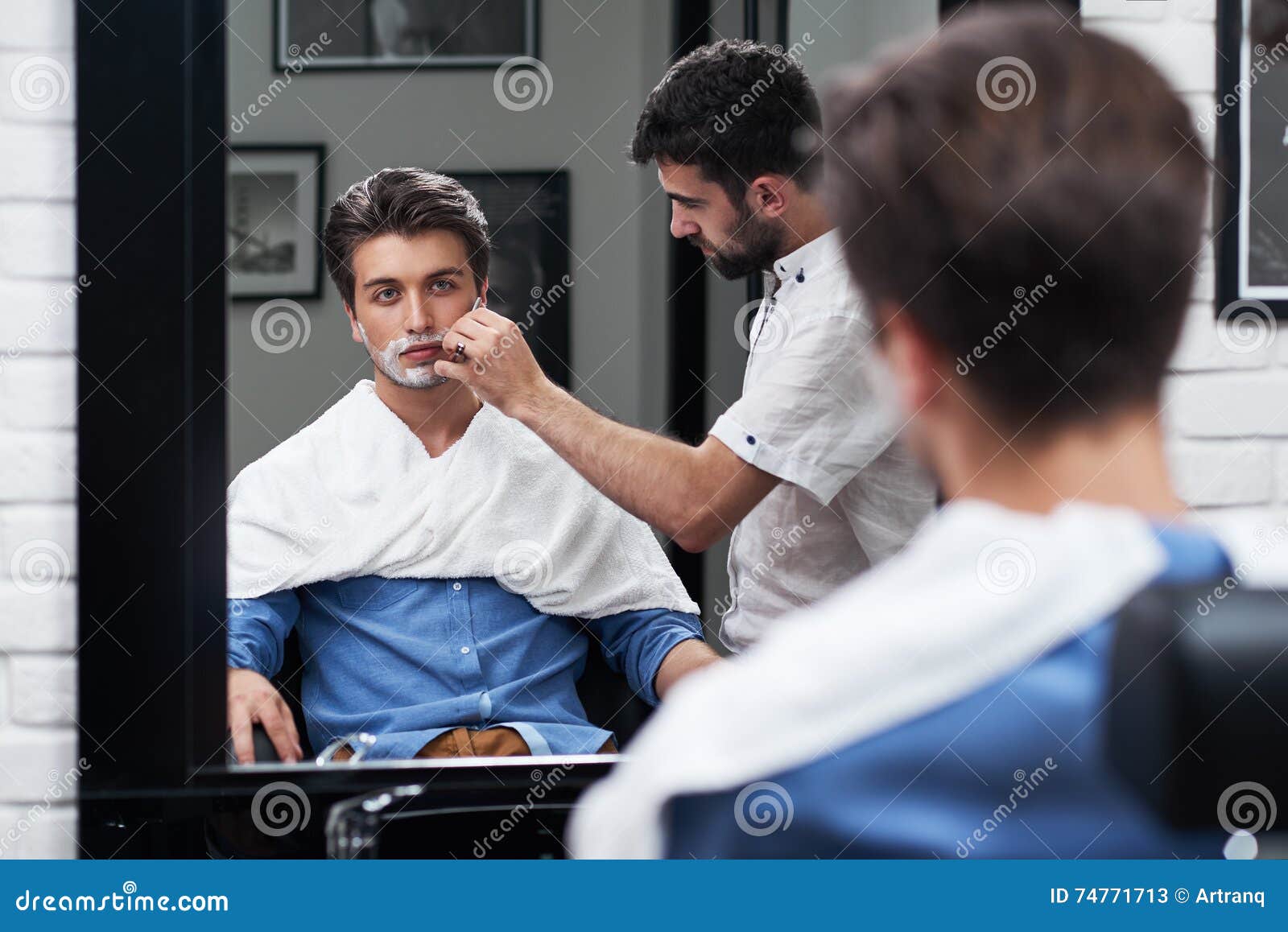 The Barber is Shaving the Client S Beard Stock Image - Image of ...