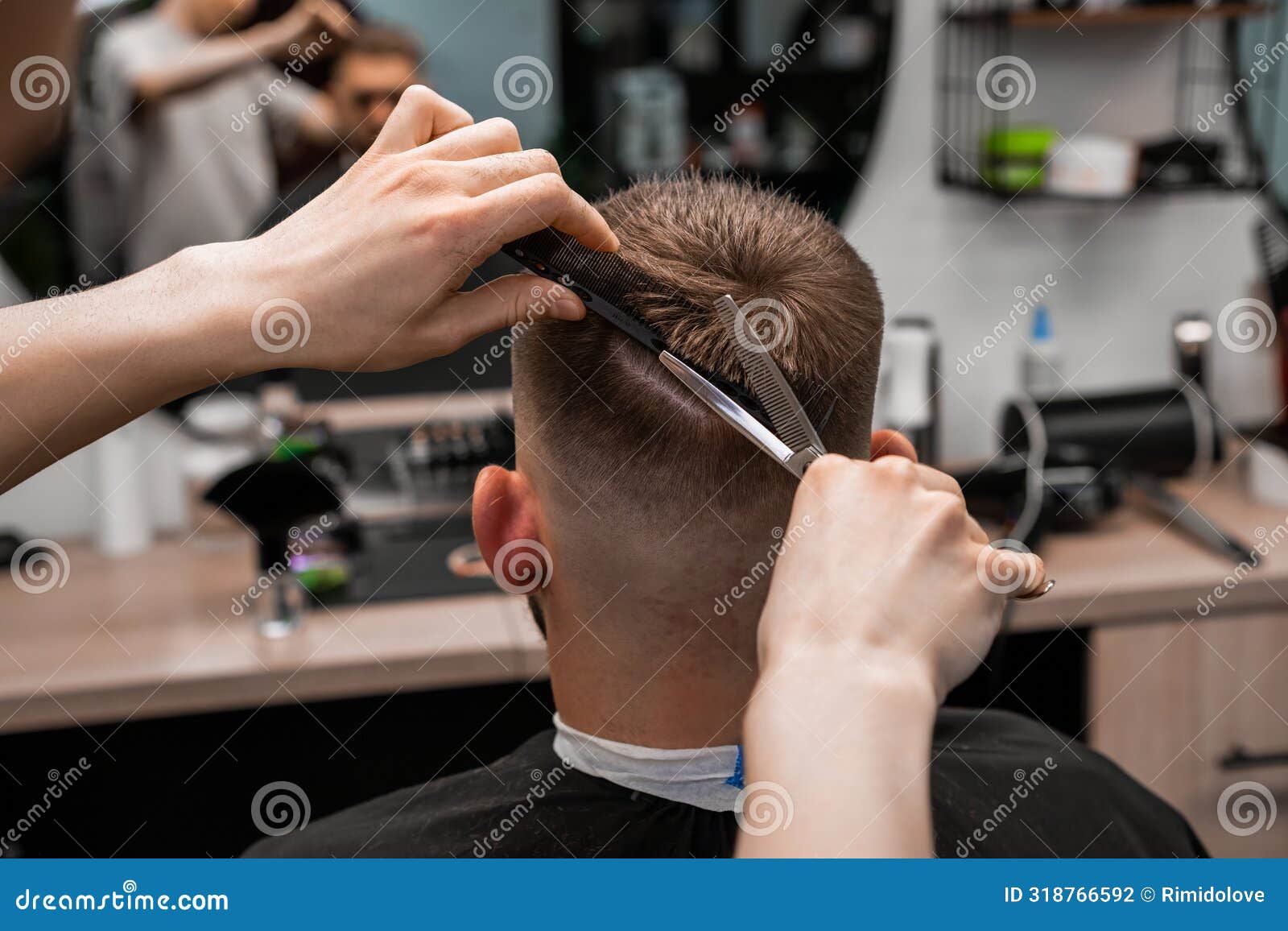 Barber Using Scissors and Comb Styling Man Hair at the Barbershop ...