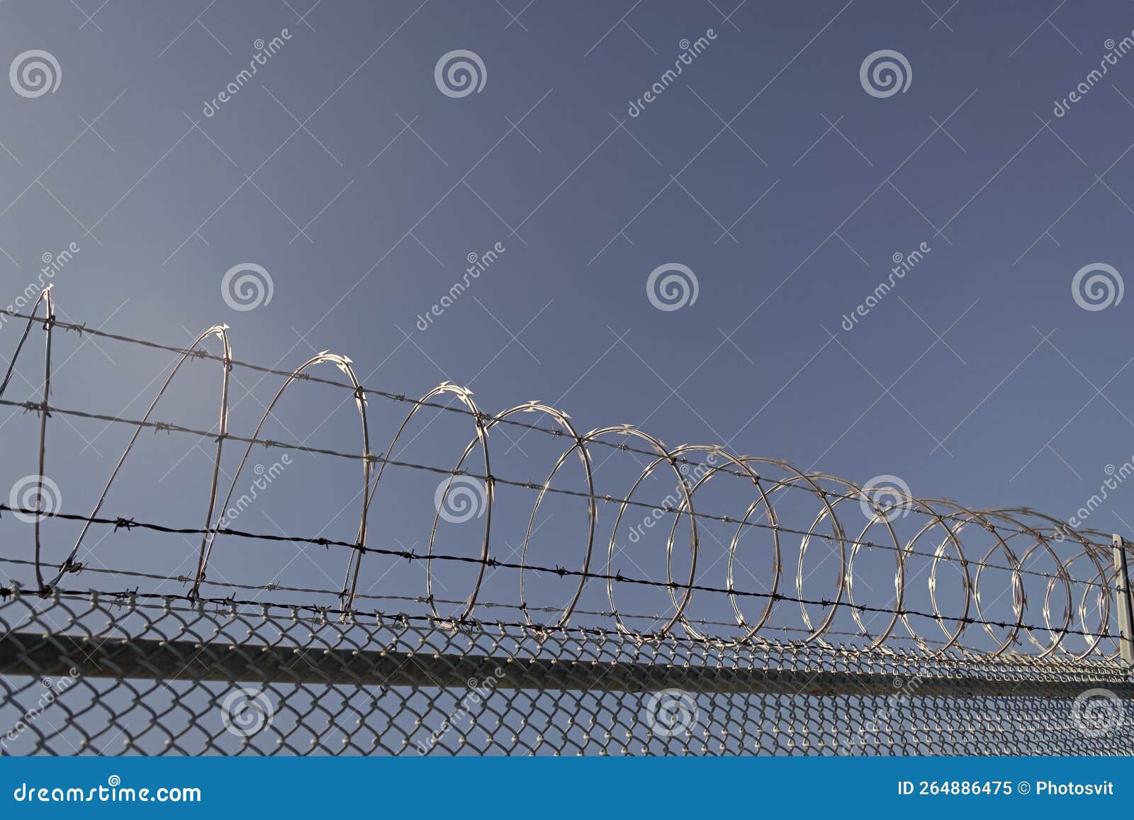 Barbwire Prison Wall with Barbed Wire Fence Coiled Razor Wire Perimeter ...
