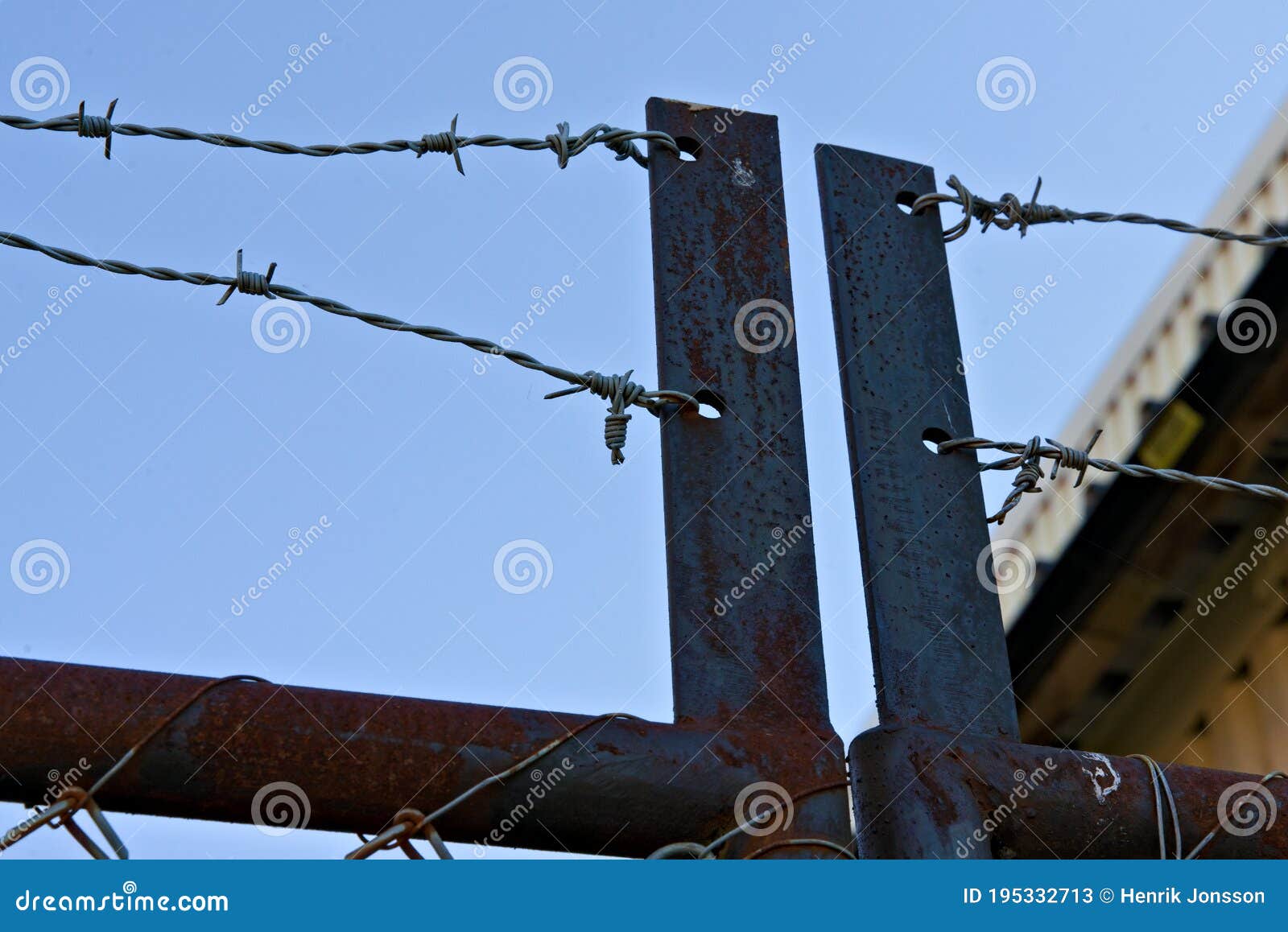 Barbwired perimeter gate stock image. Image of crime - 195332713
