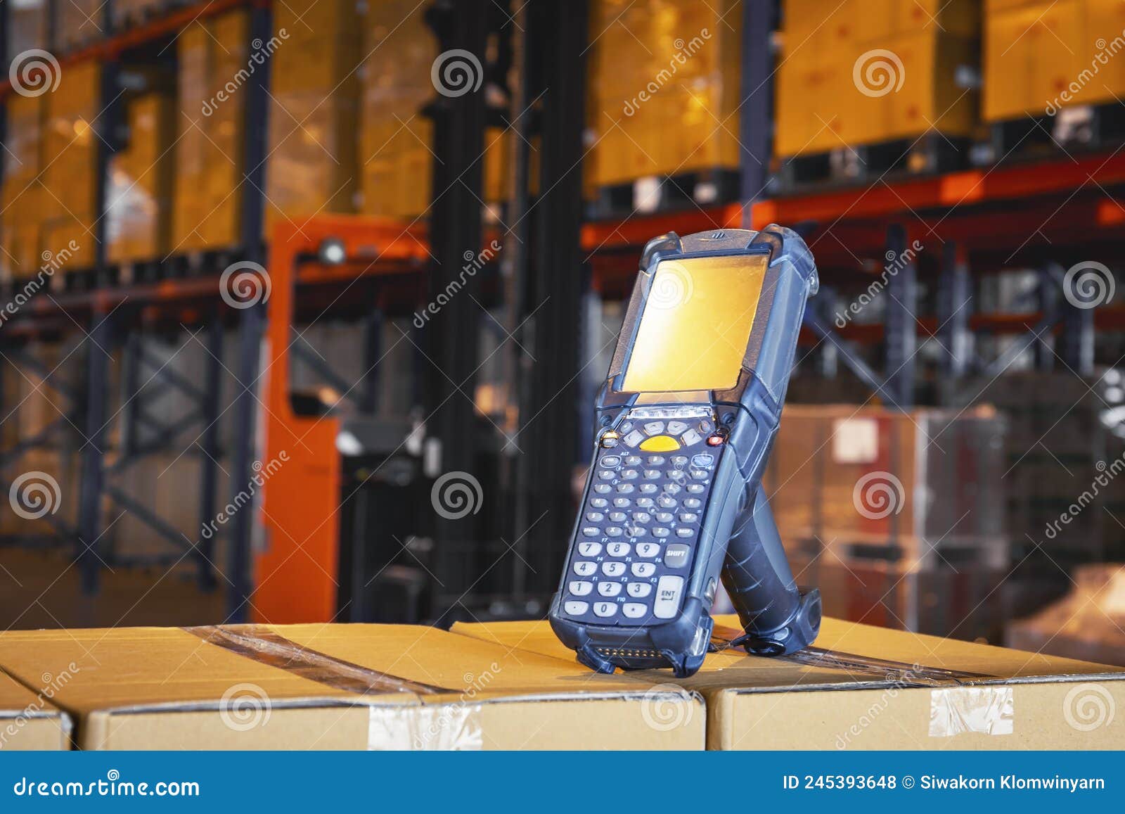 Barcode Scanner on Packaging Boxes in the Warehouse. Computer Mobile ...