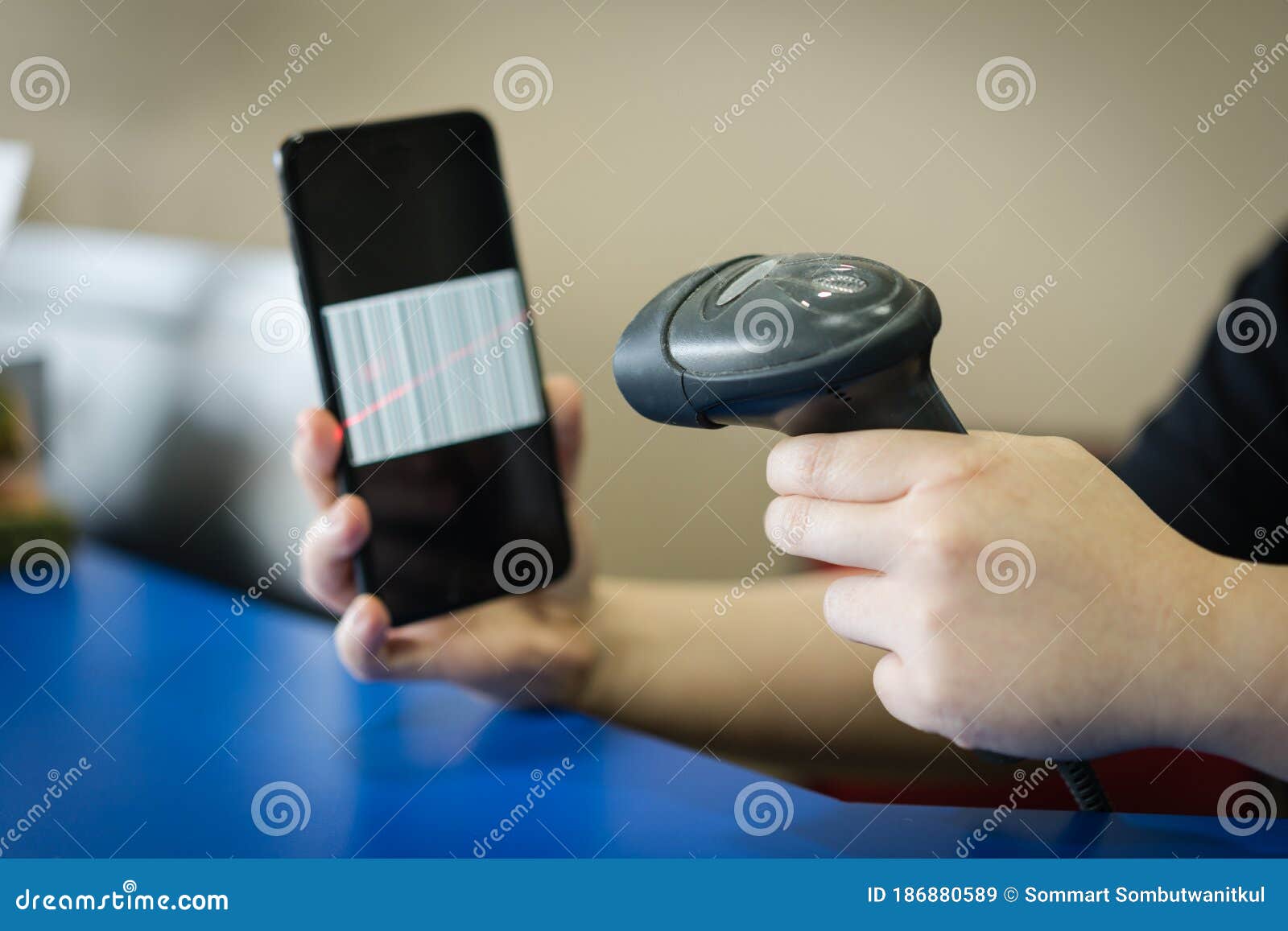 A Barcode Scanner Scanning a Barcode on a Mobile/cellular Phone Screen ...