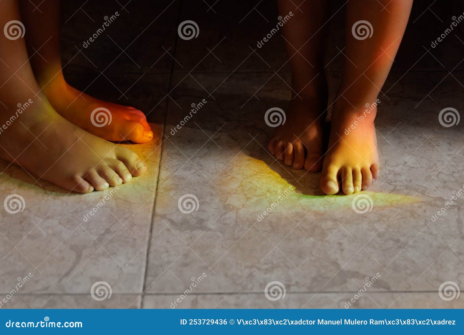 Bare Feet of Children Colored by the Diffraction of Light. Stock Photo ...