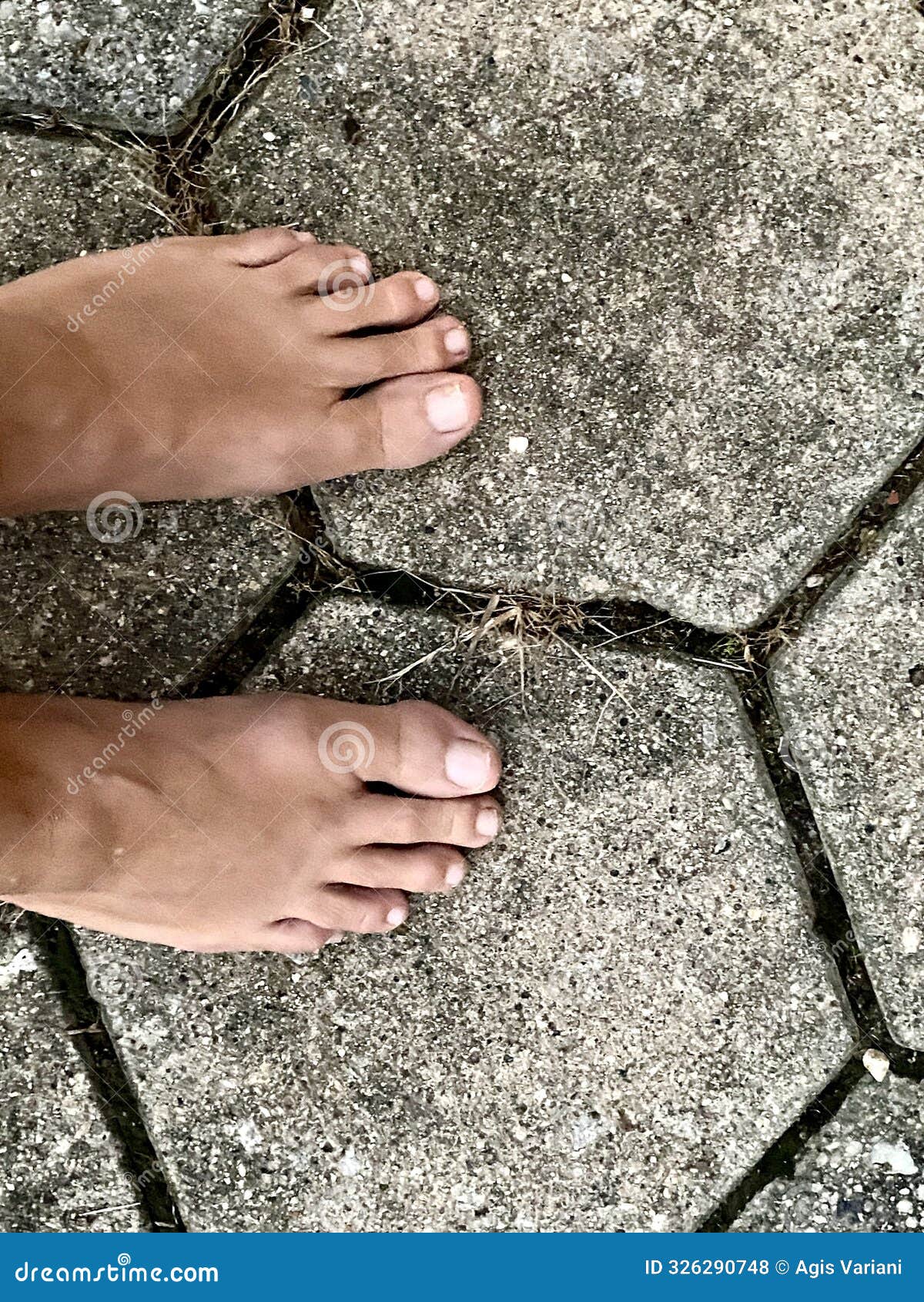 Bare feet on the pavement stock photo. Image of long - 326290748