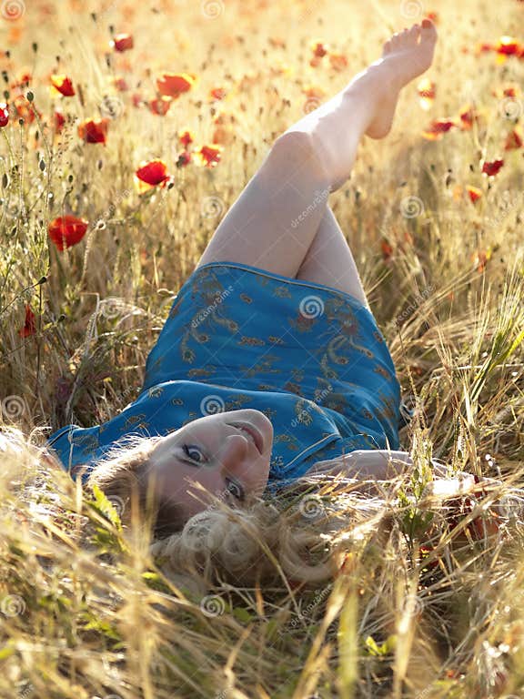 Barefoot blonde in poppies stock photo. Image of looking - 9900580