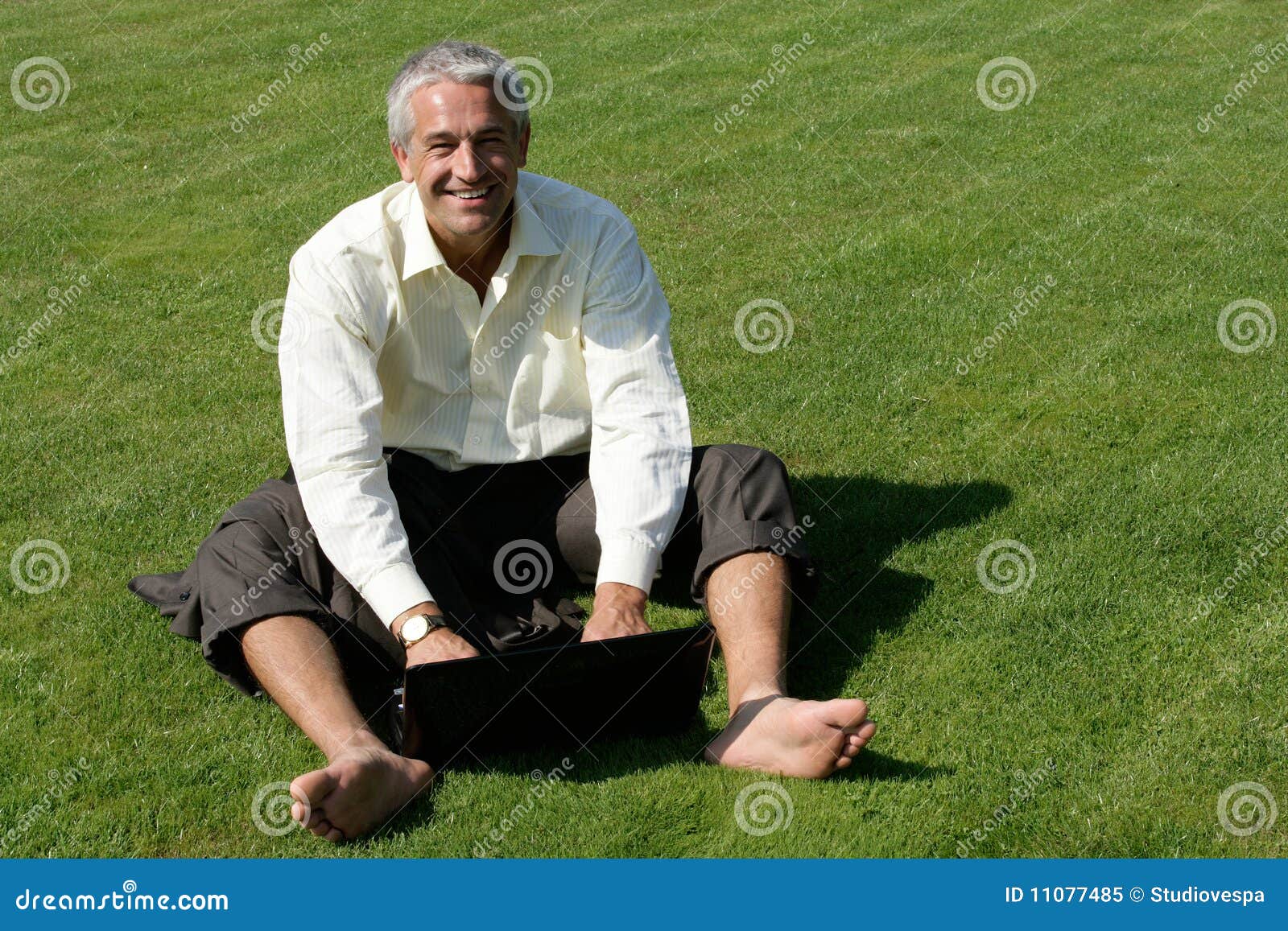 Barefoot Businessman Sitting on Grass Stock Image - Image of barefoot ...