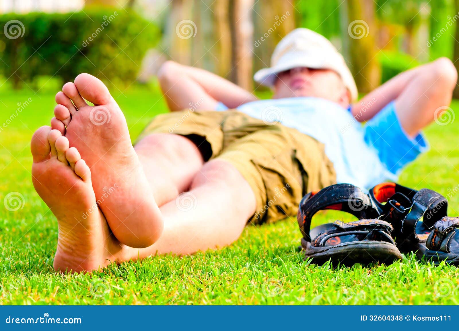 Barefoot Man Is Resting On Green Grass Royalty Free Stock Photos ...
