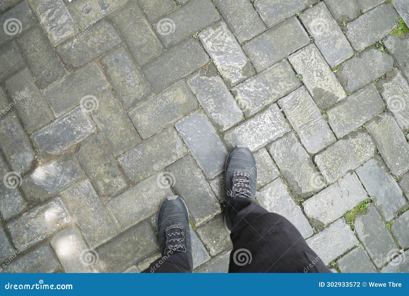 Barefoot Man Walking on Block Paving Road Stock Photo - Image of gray ...