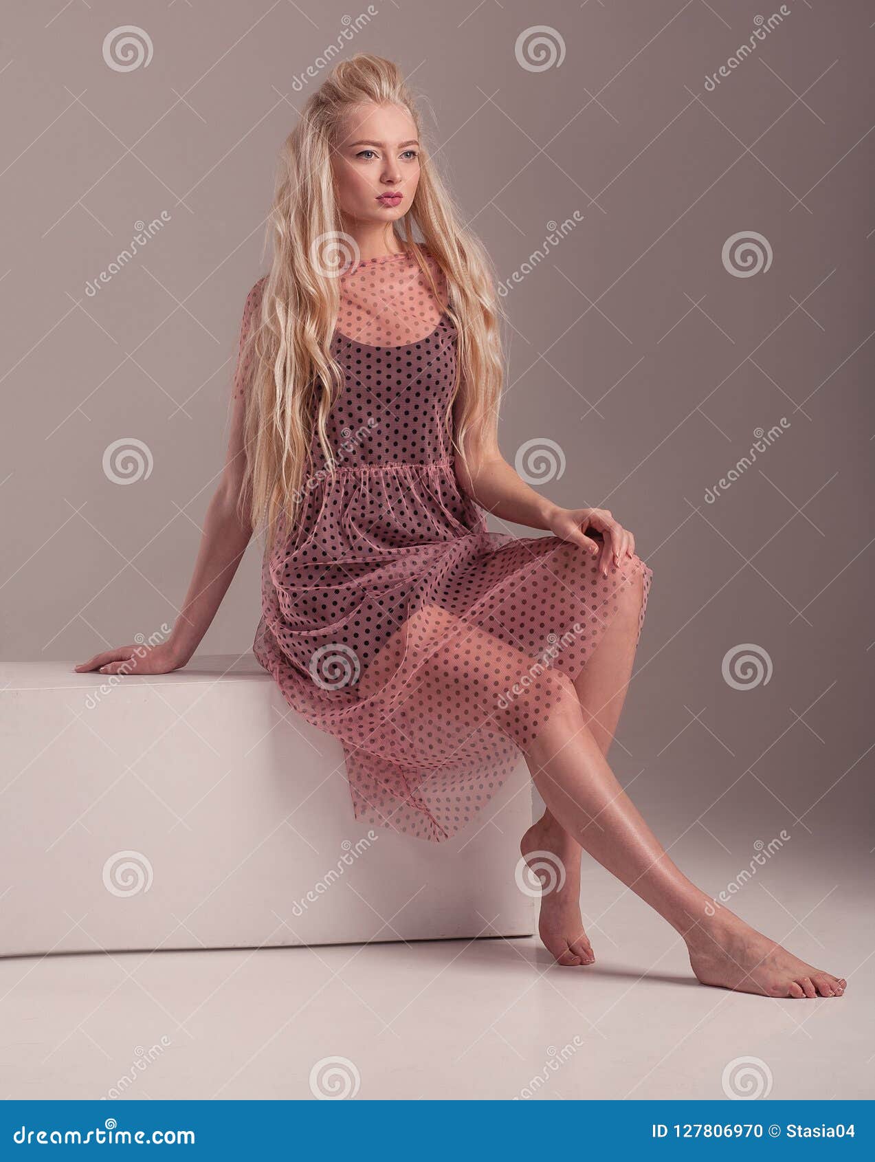 Barefoot Model In Dress Posing On Pink Background. Royalty-Free Stock ...