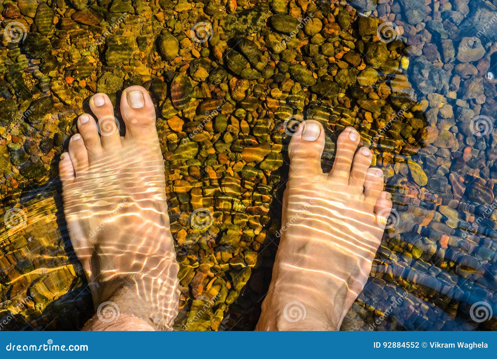 Barefoot in Water stock photo. Image of dipping, pebbles - 92884552