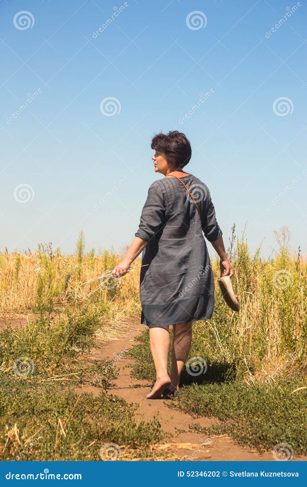 Barefooted Woman on Path through Field Stock Photo - Image of field ...