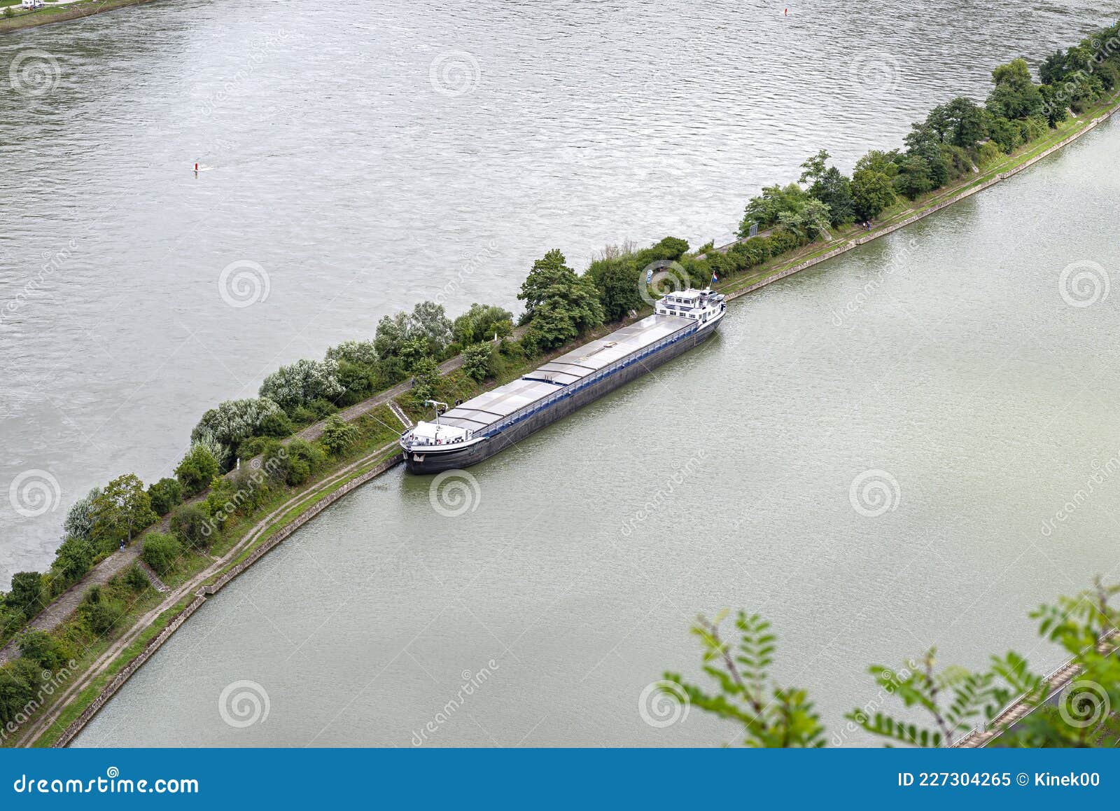 Barge with a Covered Deck Attached To the River Bank, Aerial View ...