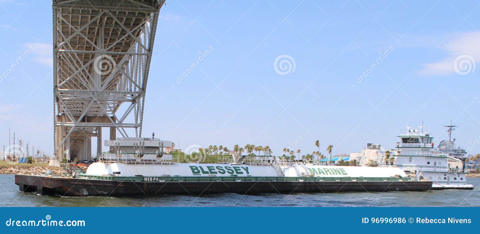 Barge going under bridge. editorial photo. Image of ship - 96996986