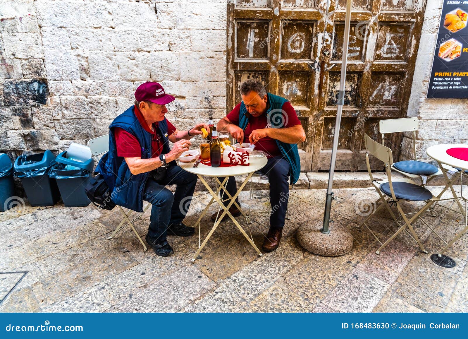 Bari, Italy - March 10, 2019: Italian Workers Having Lunch while ...