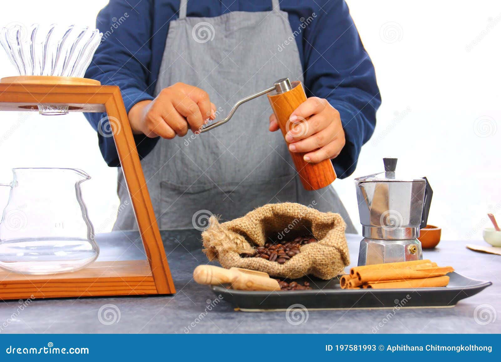 The Barista Using Coffee Grinder Grined Roasted Coffee Beans for Drip ...