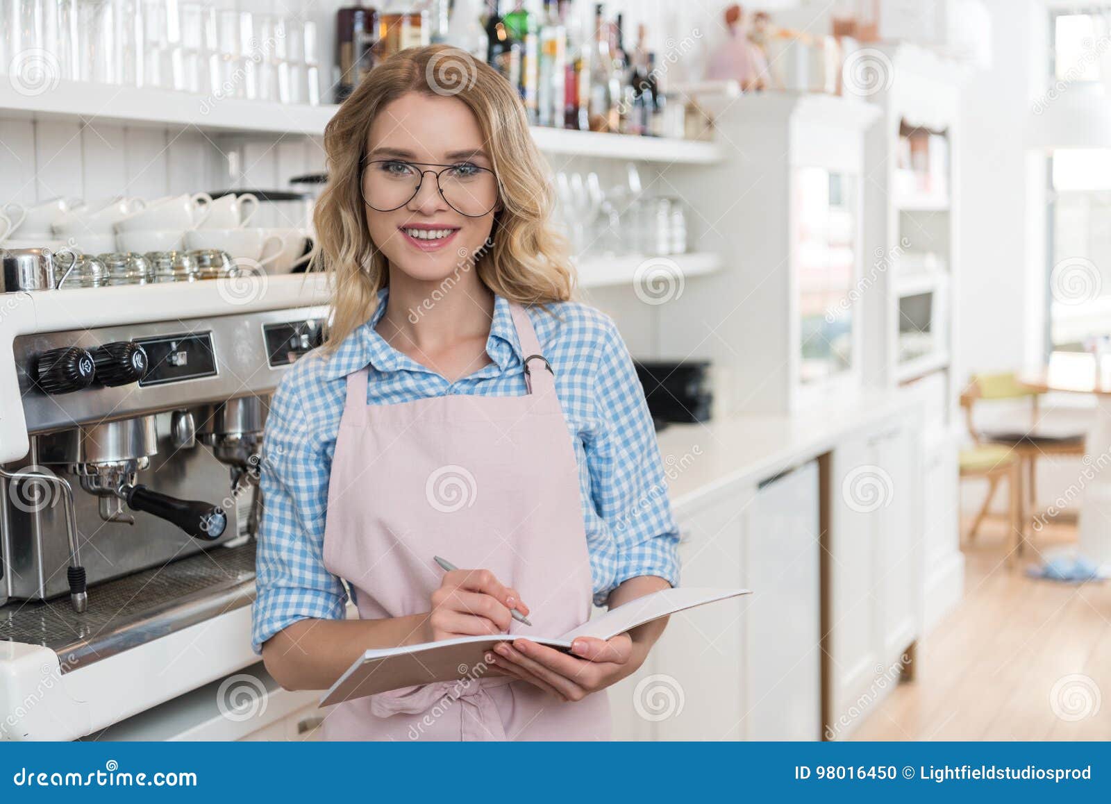 Barista Writing Notes in Notebook during Work in Coffee Shop Stock ...