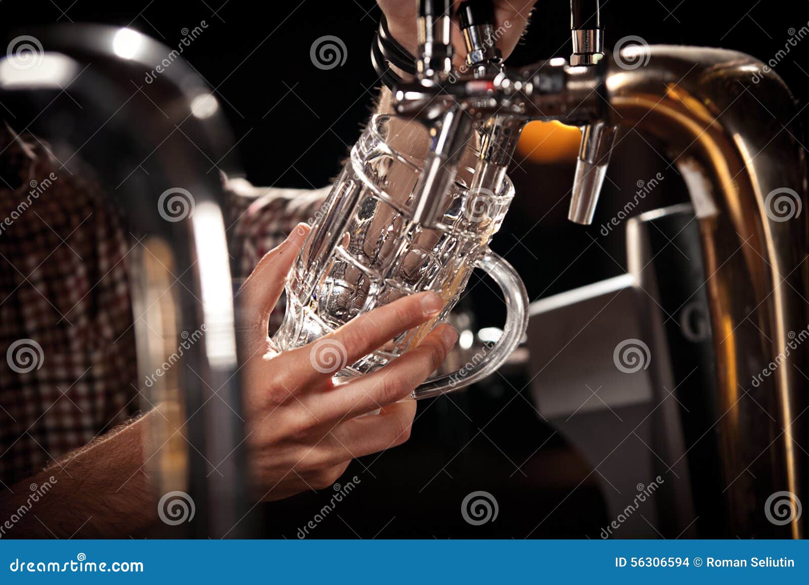 Barkeeper Pulling a Pint of Beer Behind the Bar Stock Photo - Image of ...