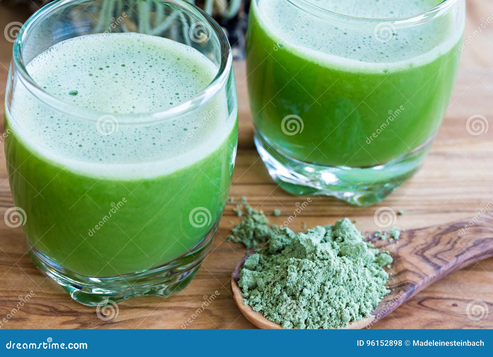 Barley Grass Powder on a Spoon, with Two Barley Grass Shots Stock Photo ...