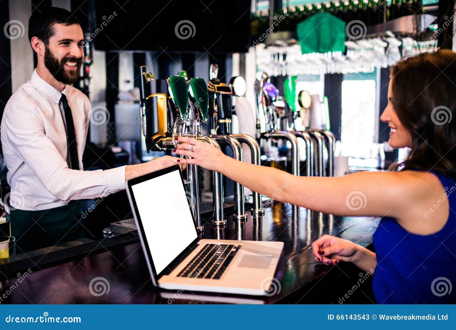 Barman Giving a Drink To Customer Using Laptop Stock Image - Image of ...