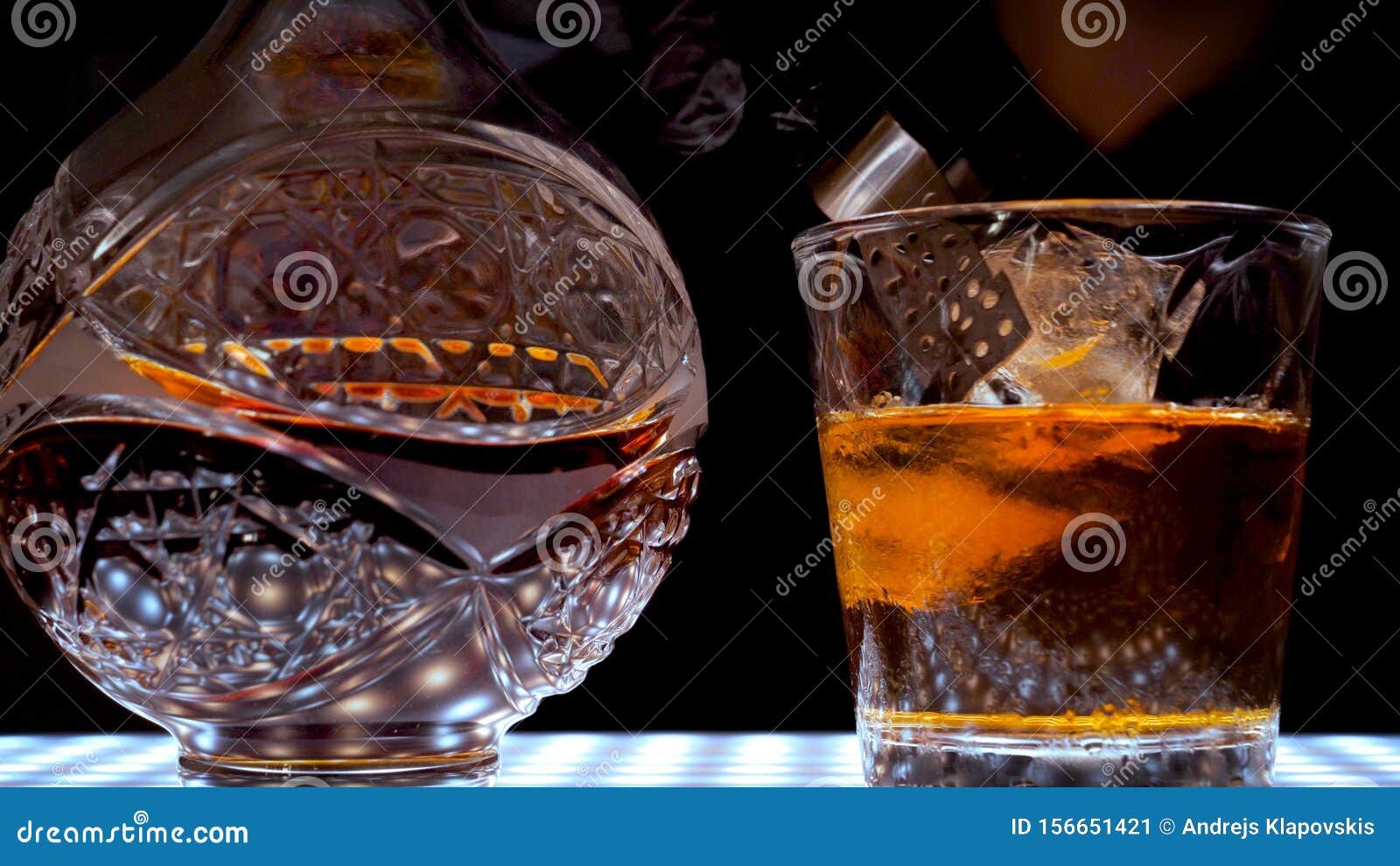 The Barman Makes An Alcoholic Drink, A Pineapple, A Black Background ...