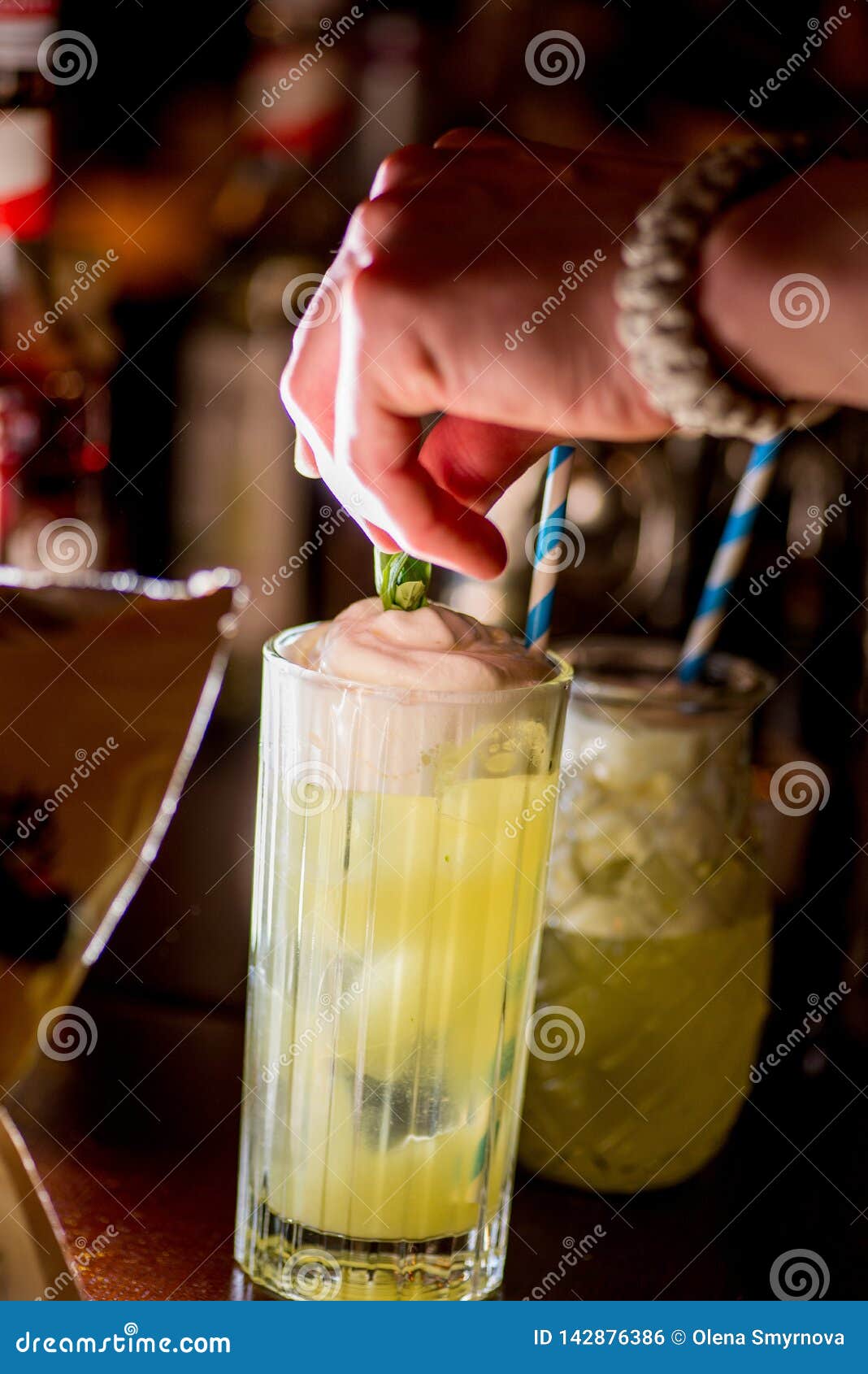 Barman preparing cocktail stock photo. Image of glass - 142876386