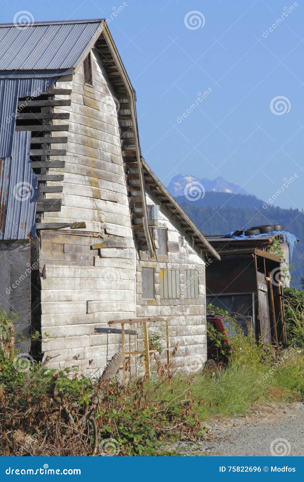 Barn Facade and Mountain stock photo. Image of paint - 75822696