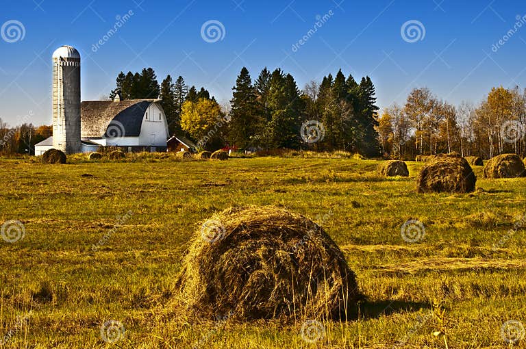 Barn with Rolls of Hay, Wisconsin Stock Photo - Image of agricultural ...
