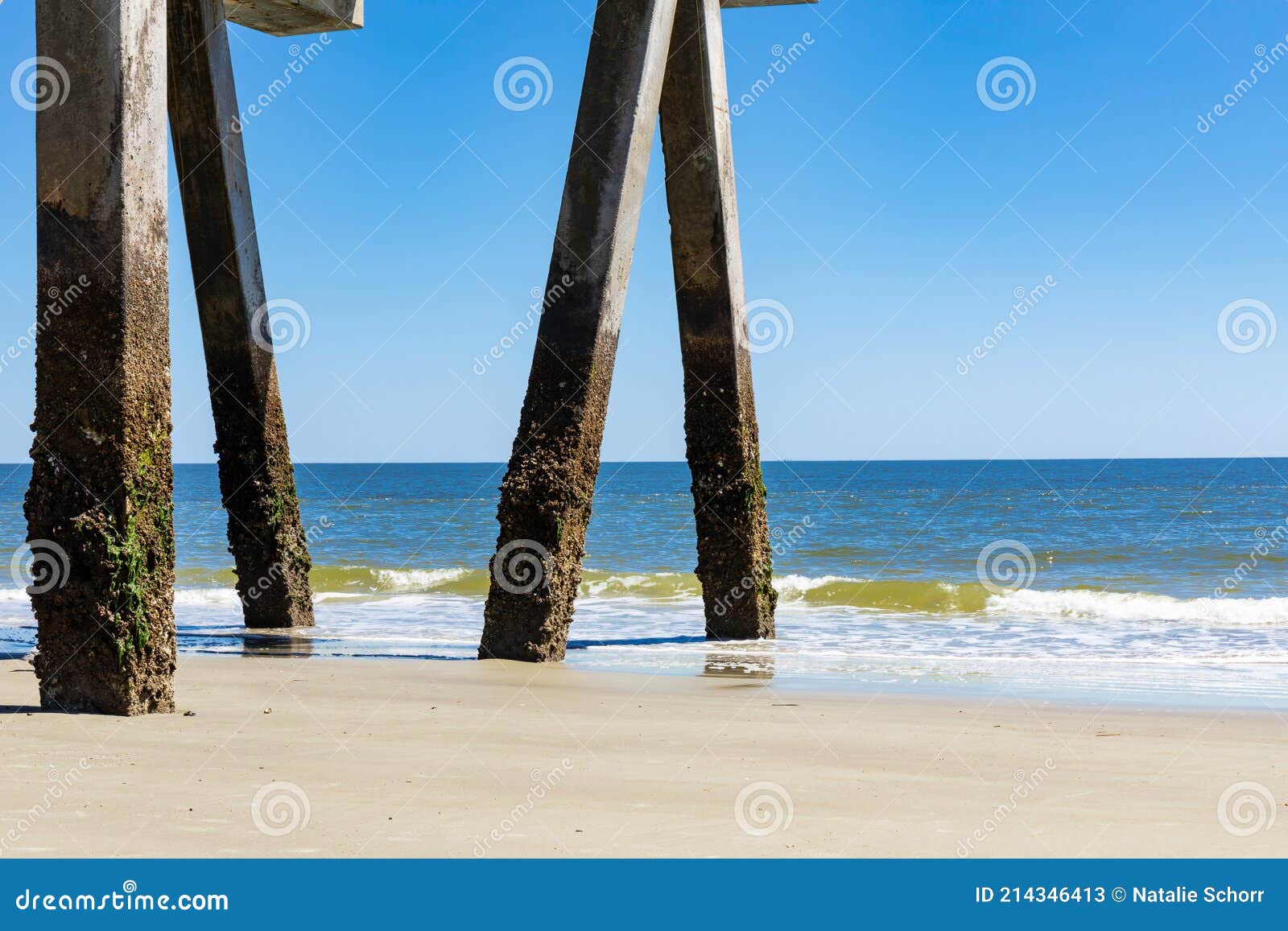 Barnacle Covered Concrete Pier Pilings by Blue Ocean Waters, Bright ...