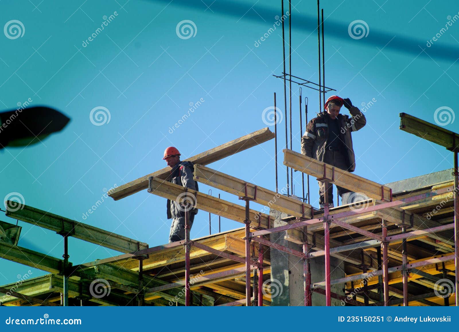 A Bricklayer Worker Erects A Wall On The Construction Of A Multi-storey ...