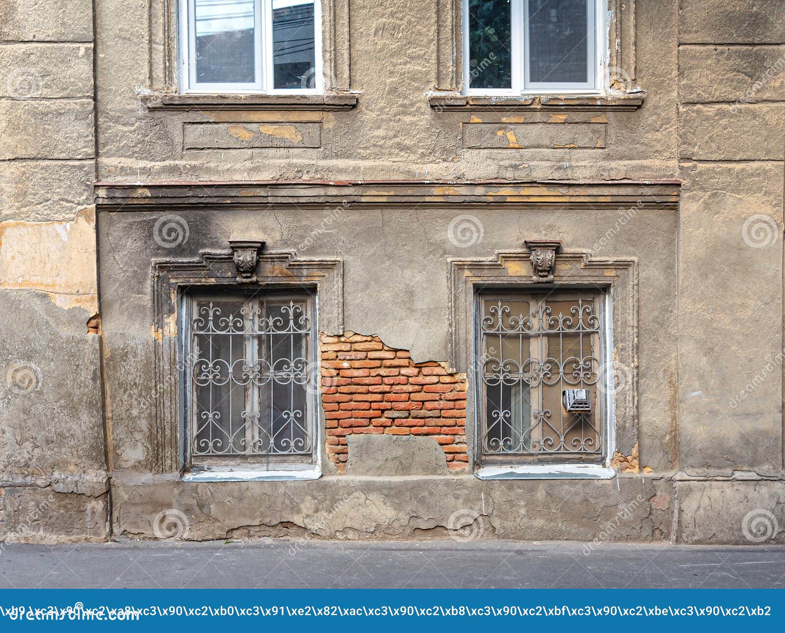 Barred Windows in the Wall of an Old House with Fallen Plaster Stock ...