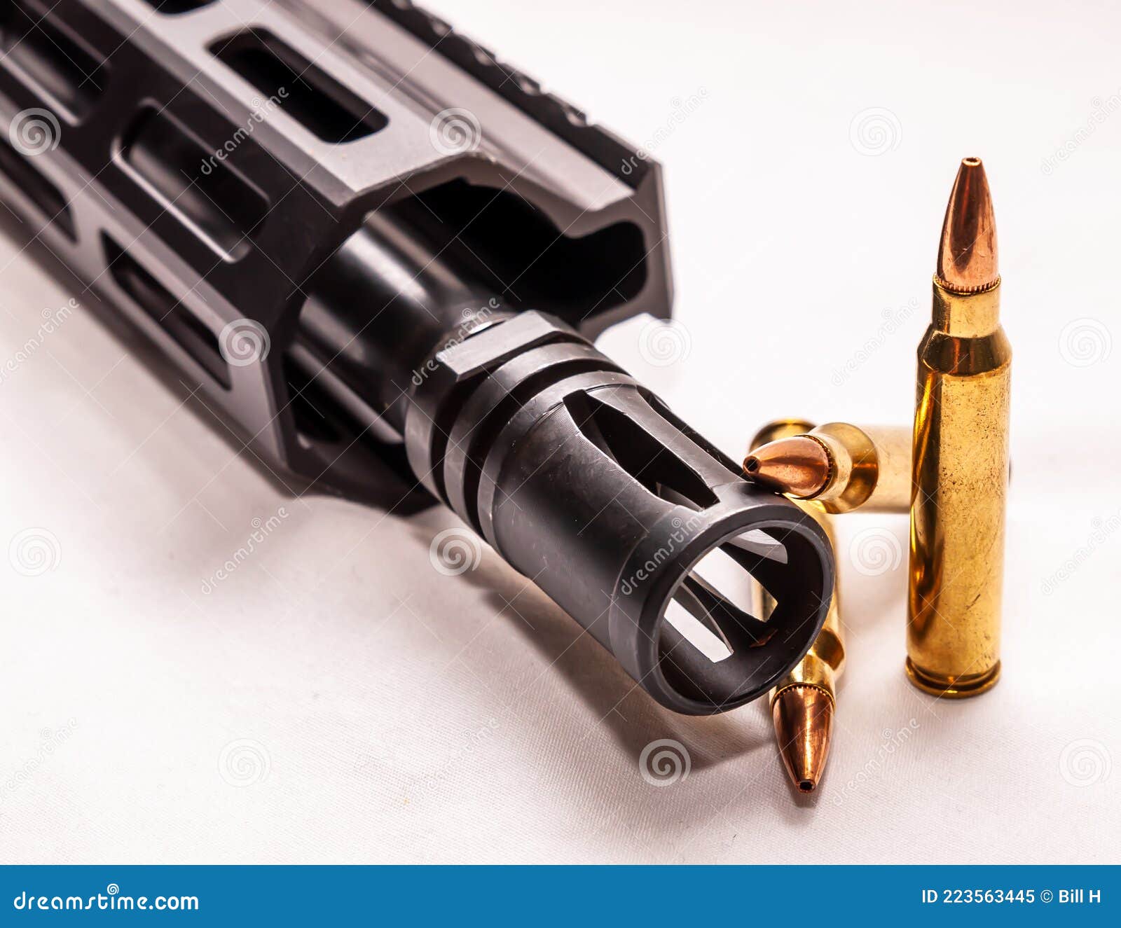 The Barrel and Muzzle of a 223 Caliber Rifle with Three Bullets for it ...