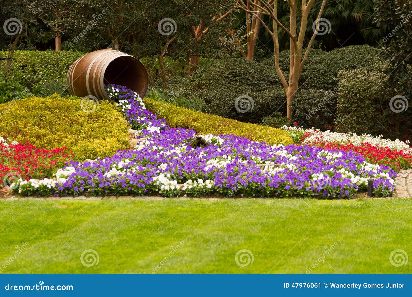 Barrel with a Waterfall of Flowers Stock Image - Image of field, spring ...