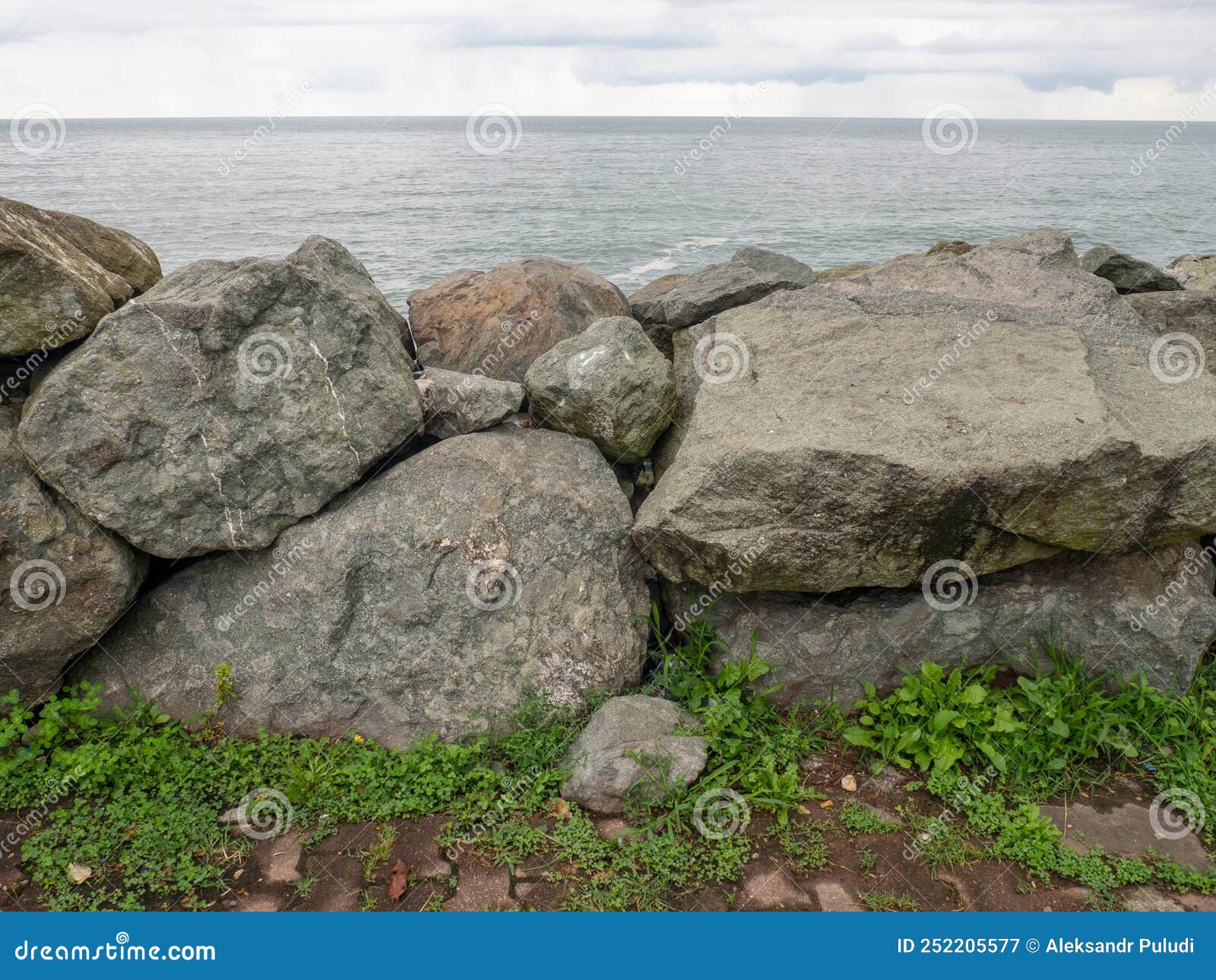 Barrier of Large Stones on the Seashore. Wave Protection. Irregular ...