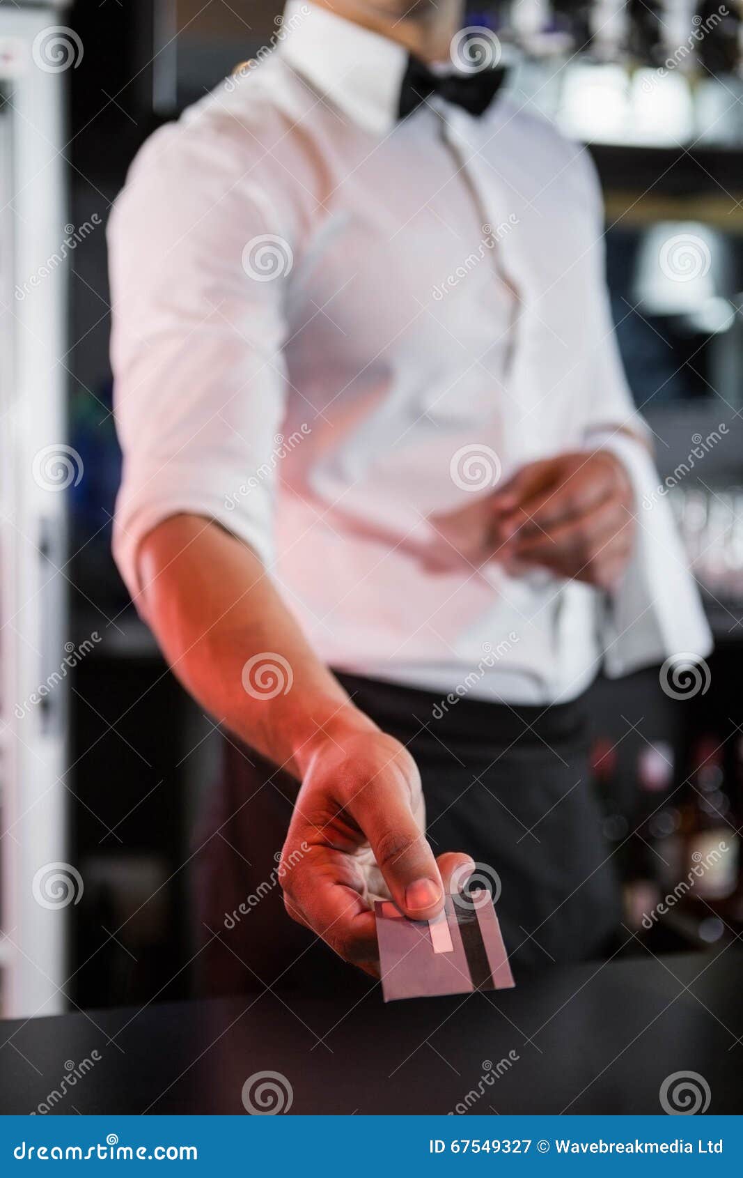 Bartender Accepting a Credit Card at Bar Counter Stock Image - Image of ...