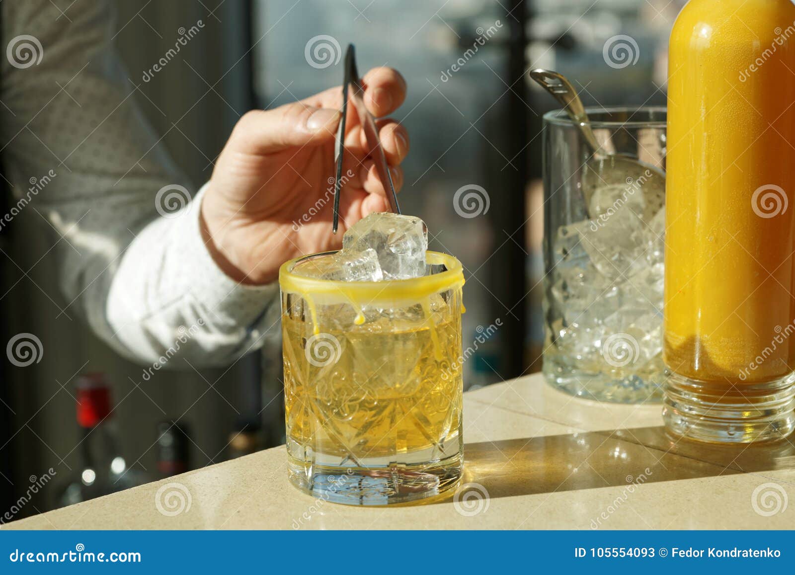 Bartender is Adding an Ice Cube To the Cocktail Stock Image - Image of ...