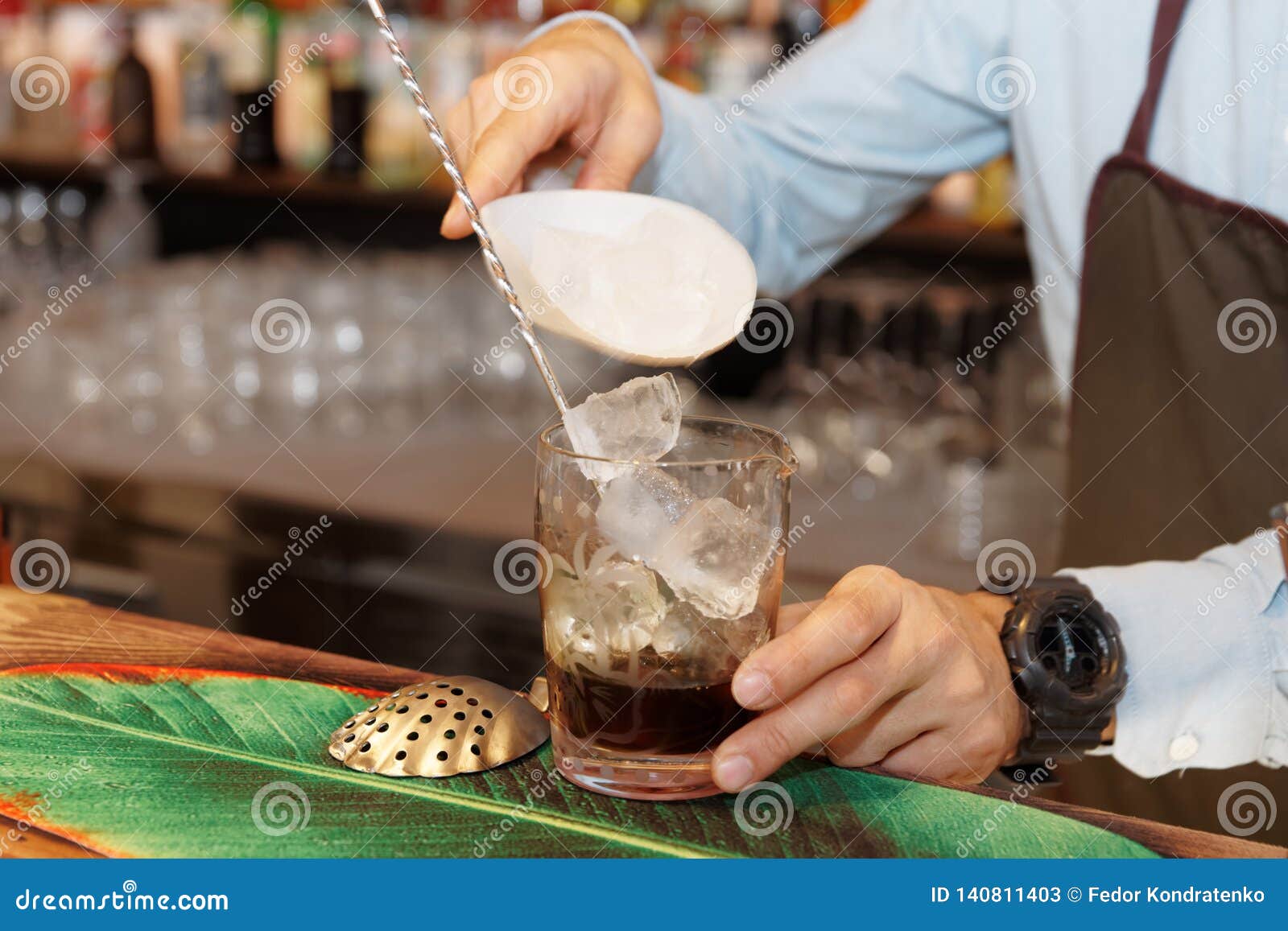 Bartender is Adding Ice Cubes To Mixing Glass Stock Image - Image of ...