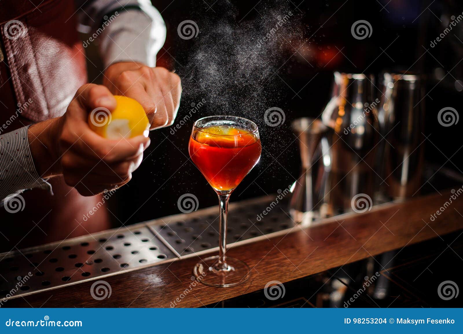 Bartender is Adding Lemon Zest To the Cocktail at Bar Counter ...