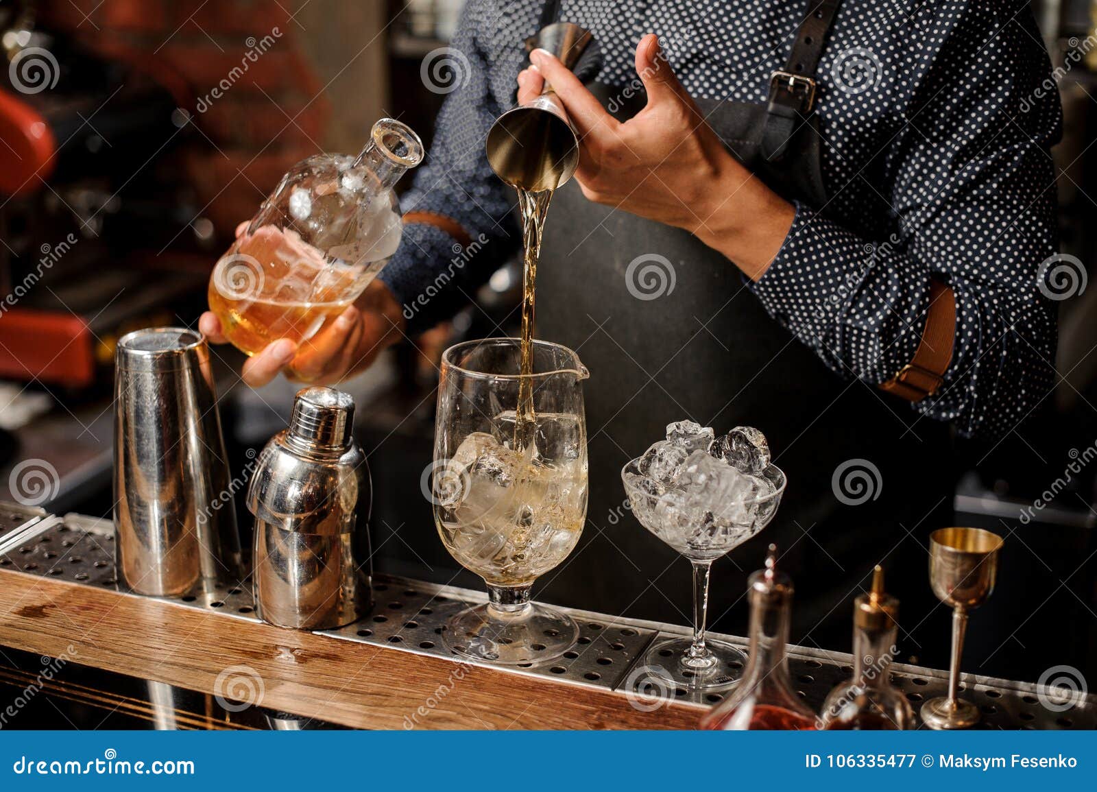 Bartender Adding a Portion of Syrup into the Large Cocktail Glass Stock ...