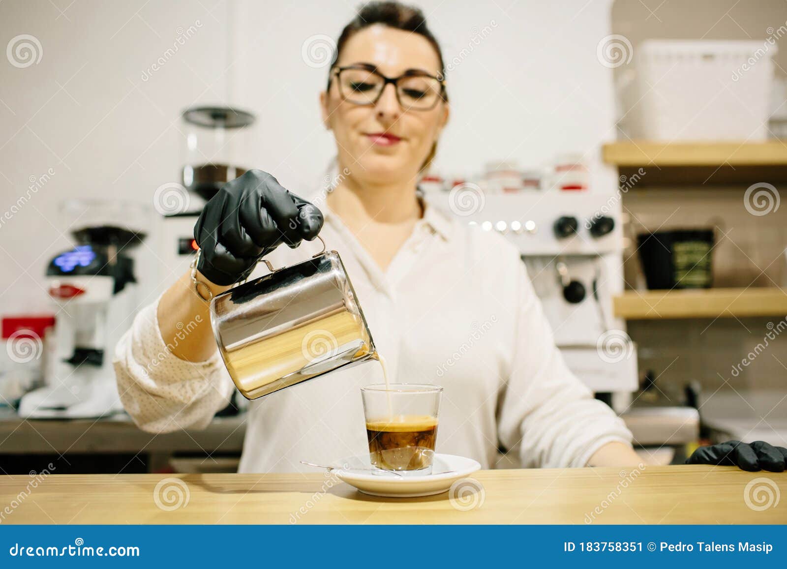 Bartender Behind a Restaurant Bar Preparing a Latte. Inside Stock Image ...