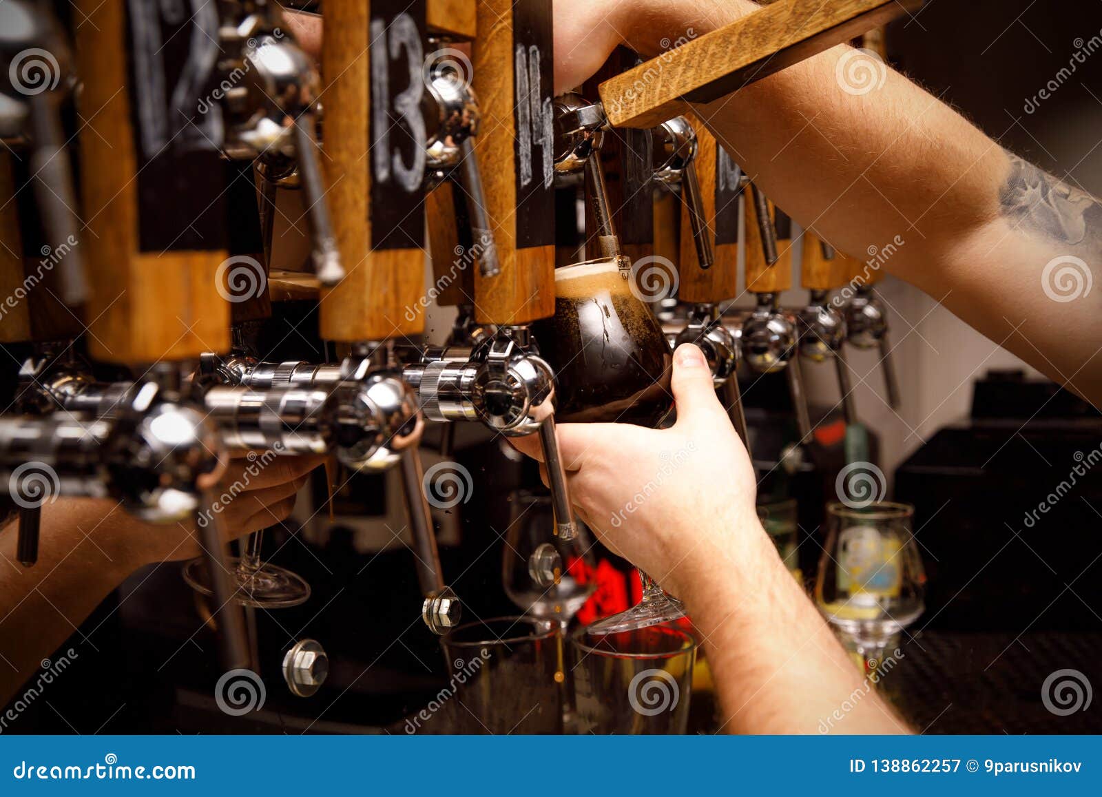 Bartender Filling Up a Dark Beer in a Glass Stock Image - Image of ...