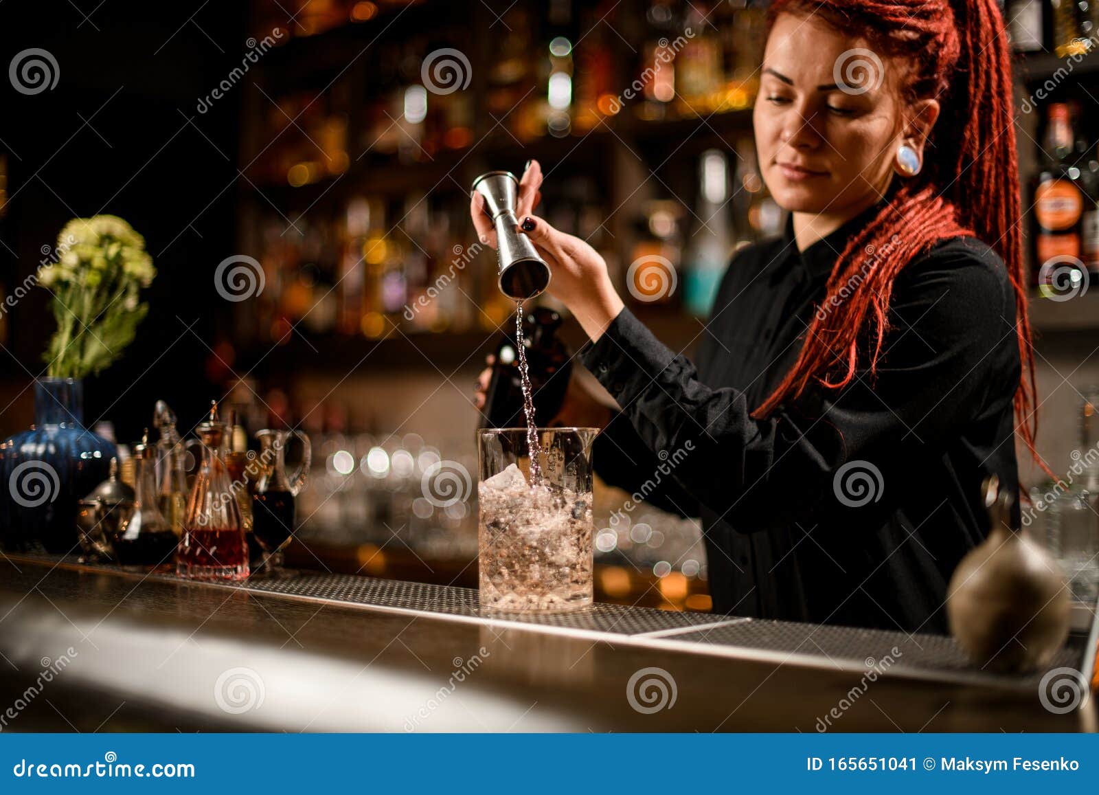 Bartender Flows Alcohol from Bottle with Jigger Stock Image - Image of ...