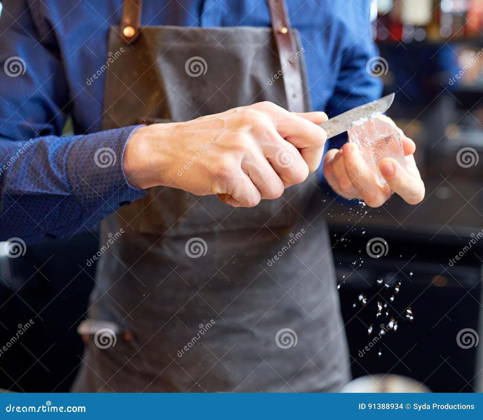 Bartender Grinding Ice Cube with Knife at Bar Stock Photo - Image of ...