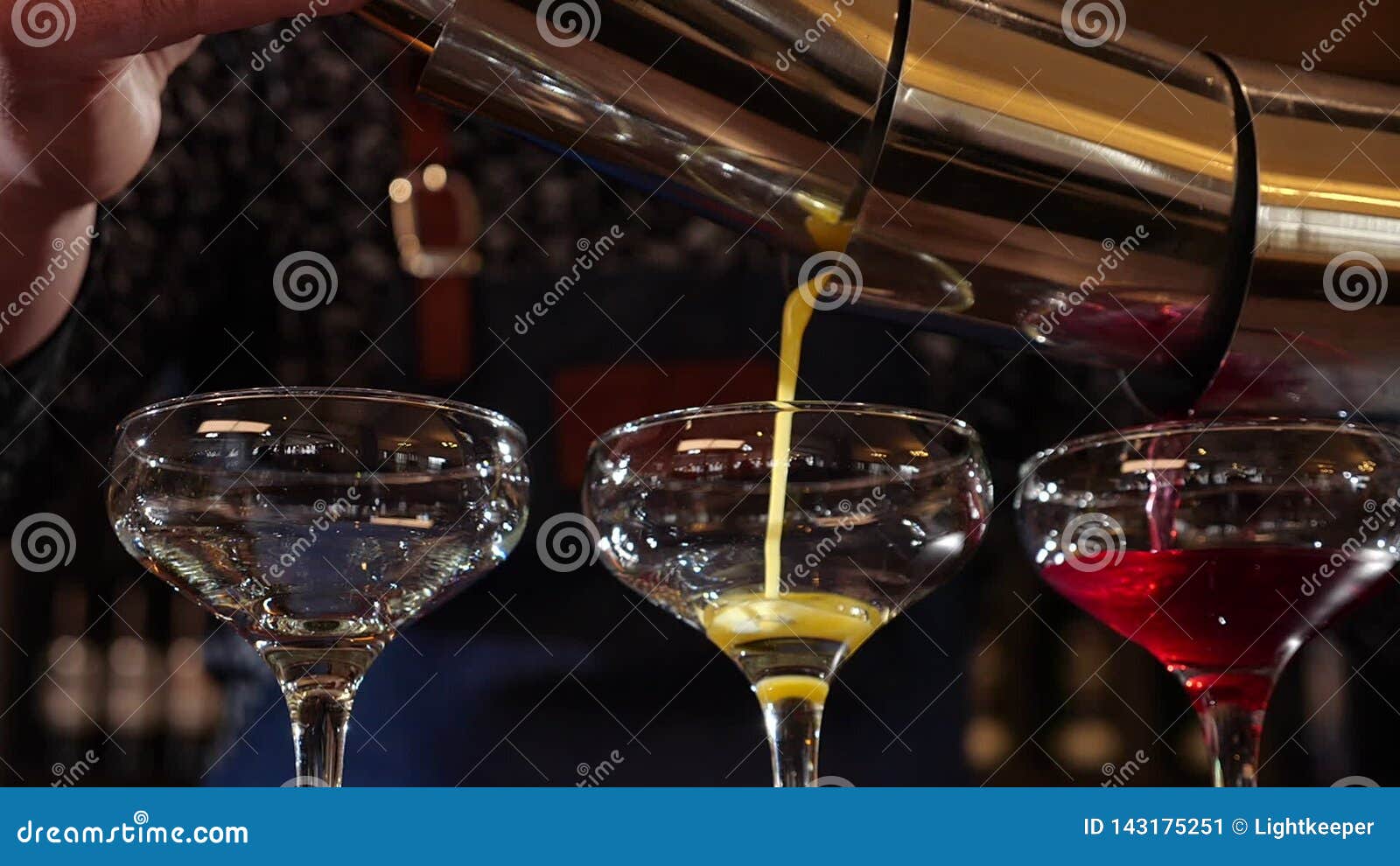 Bartender Hands Pouring Three Colored Cocktails Simultaneously - Close ...