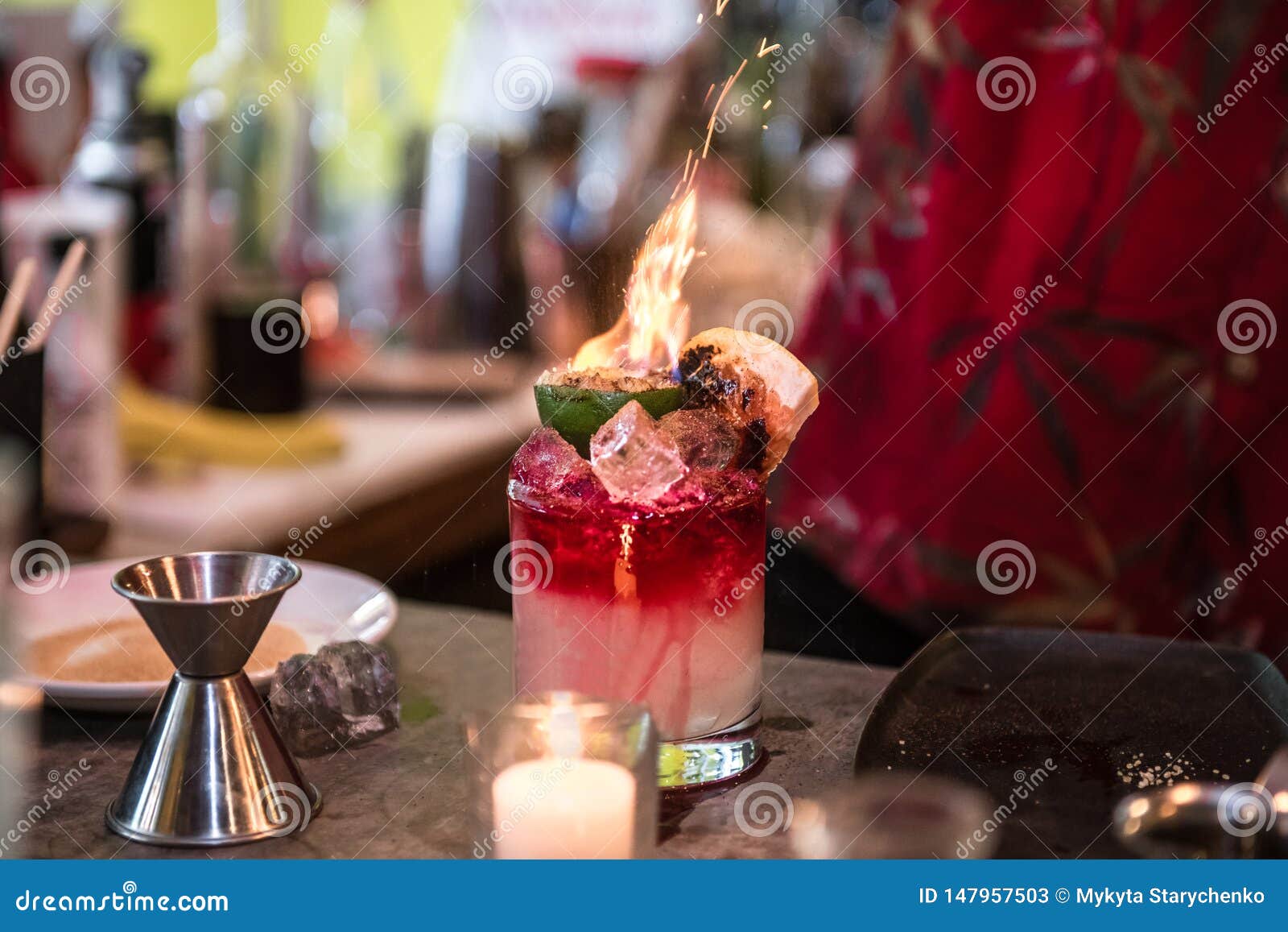 Bartender Making Fresh Tropical Alcohol Cocktails with Fire on the Bar ...